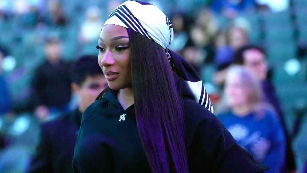 Megan Thee Stallion pairs leotard with sheer tights for Dunkin'