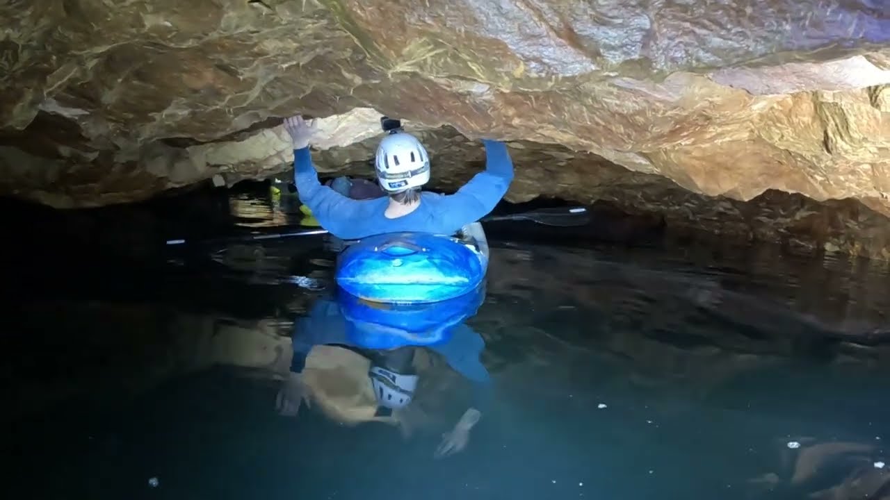 Kayaking through an abandoned marble mine beneath solid rock