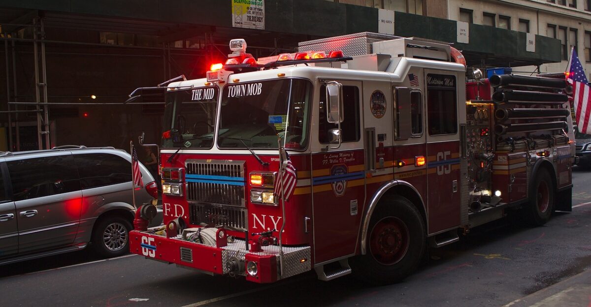 New York firefighters scramble to control a huge 4 building fire in Queens