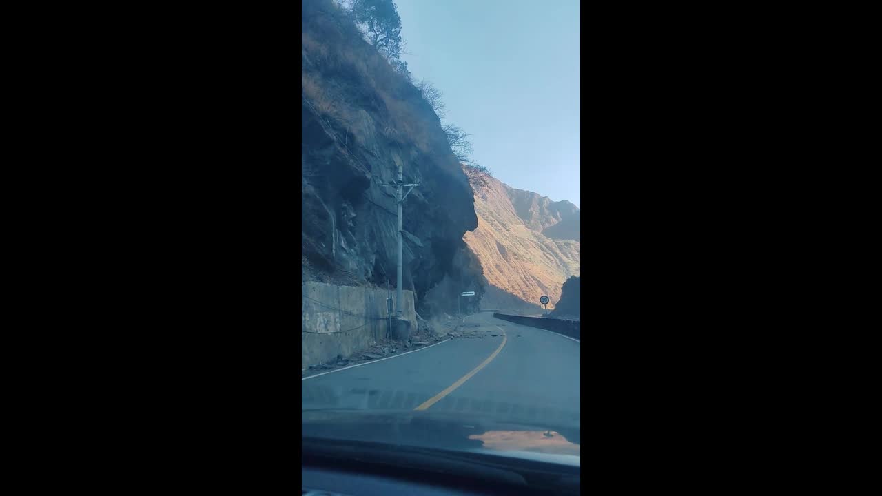 Landslide crashes onto mountain road blocking motorists in southwest China