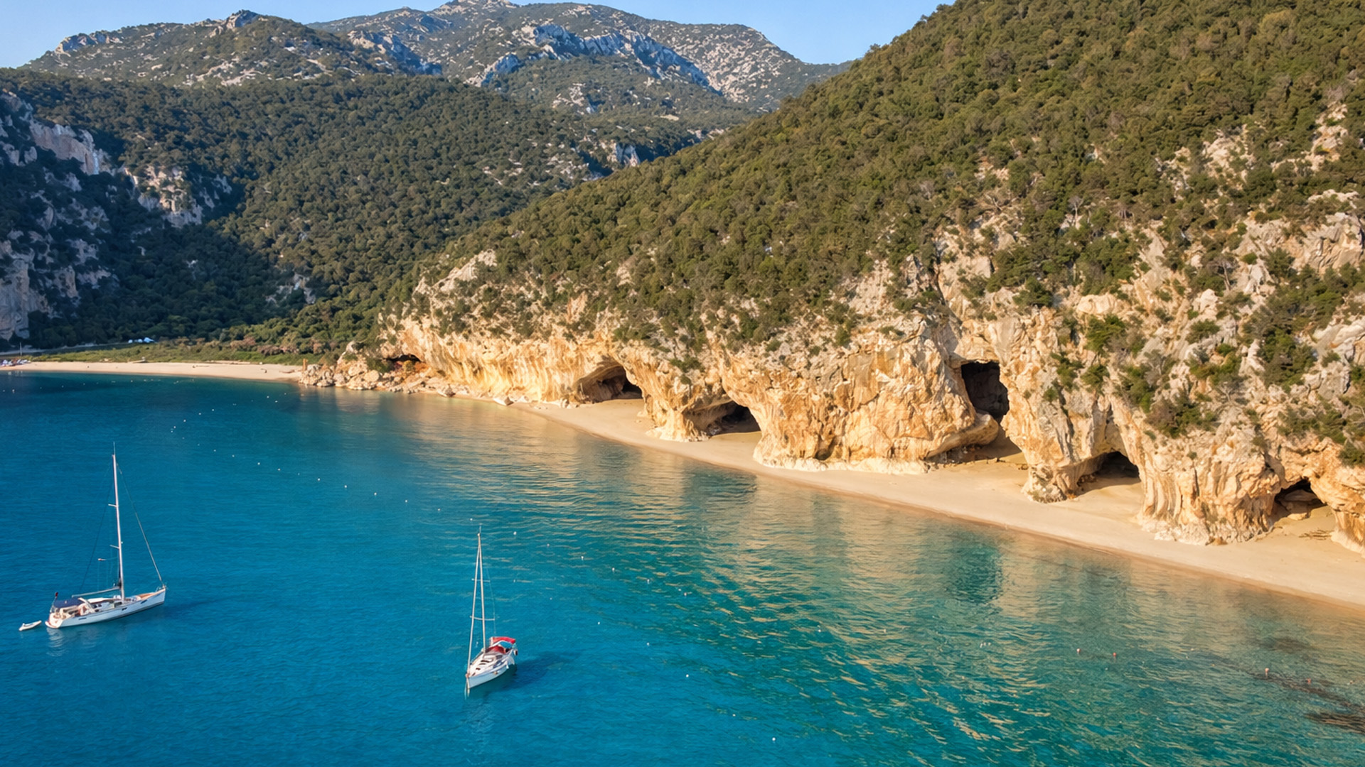 The beach with caves in the cliffs
