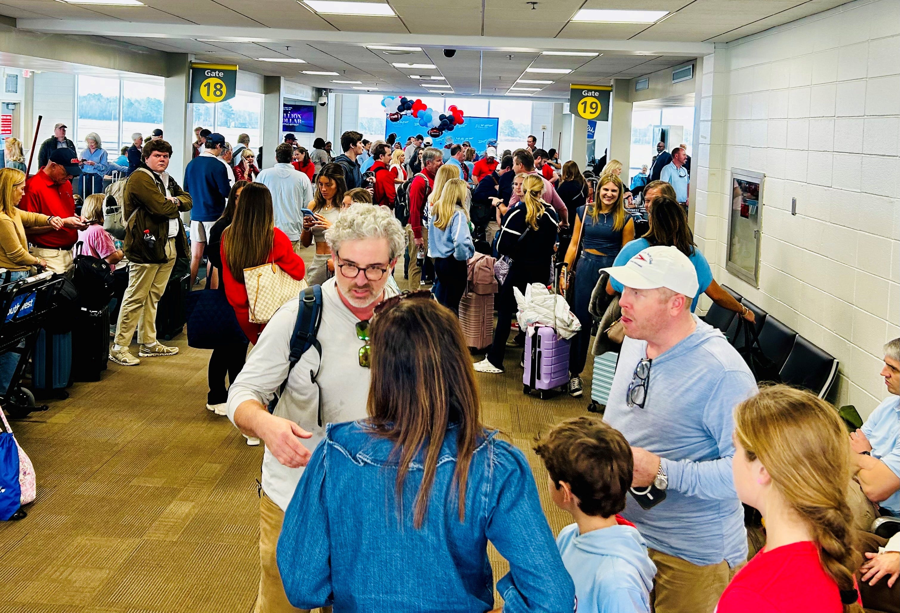 Ole Miss fans cram airports in Jackson, across Southeast headed to ...