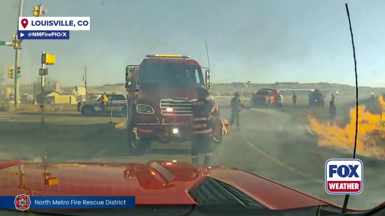 Watch: Firefighters battle heavy smoke and flames during strong winds ...