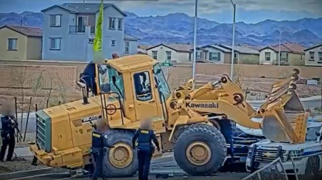 Watch: Man tries to run over Nevada officers with front loader