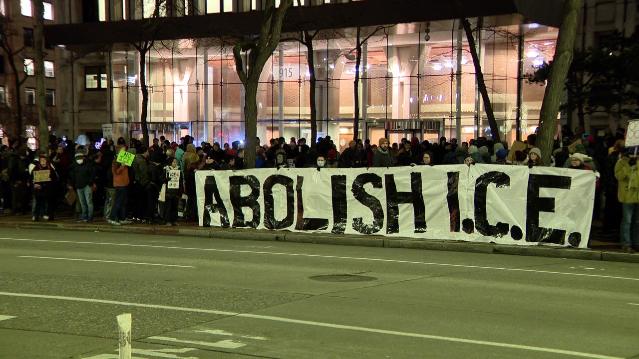 Around 200 protest fatal ICE shooting in front of Seattle's federal ...