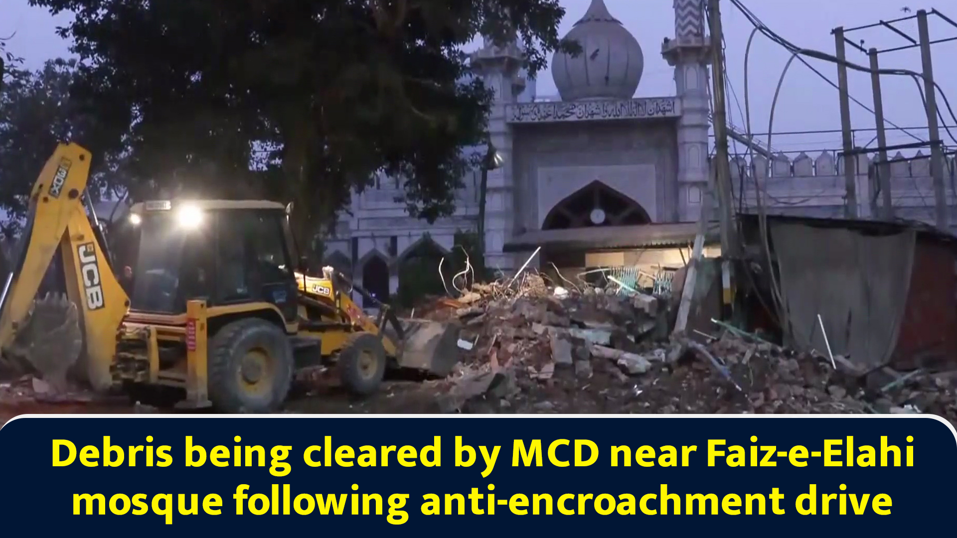 Debris being cleared by MCD near Faiz-e-Elahi mosque following anti-encroachment drive