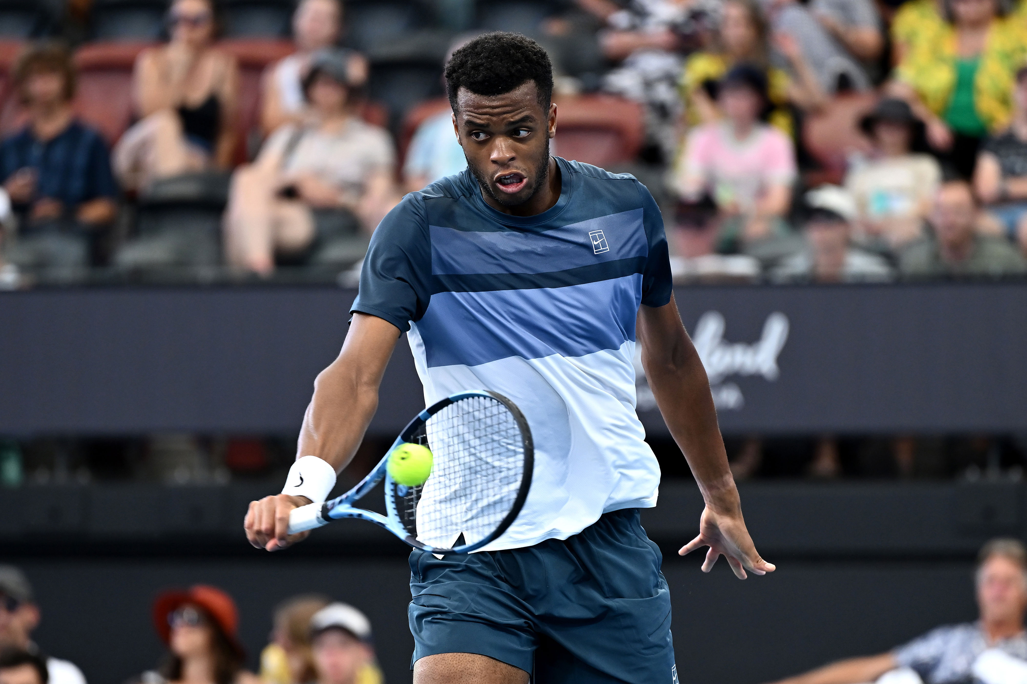 Heartbreak for Aussie cult hero in three-set 'arm wrestle'