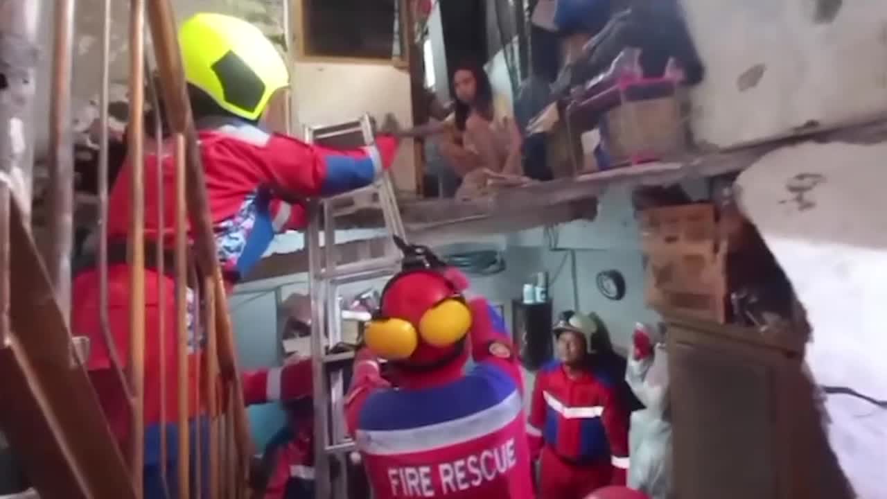 Firemen save mother and daughter trapped in collapsed house