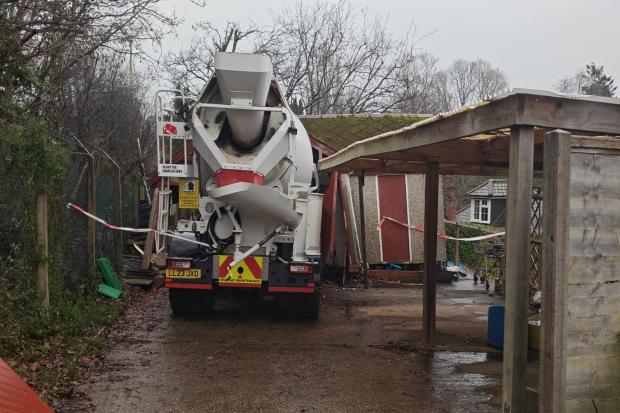 Video shows shocking moment cement lorry smashes into building