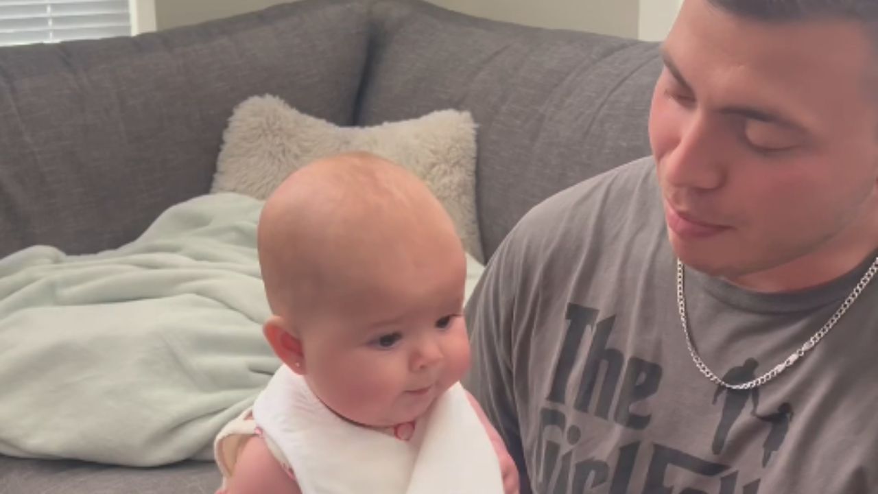 Baby girl's first encounter with apple sauce brings her smile