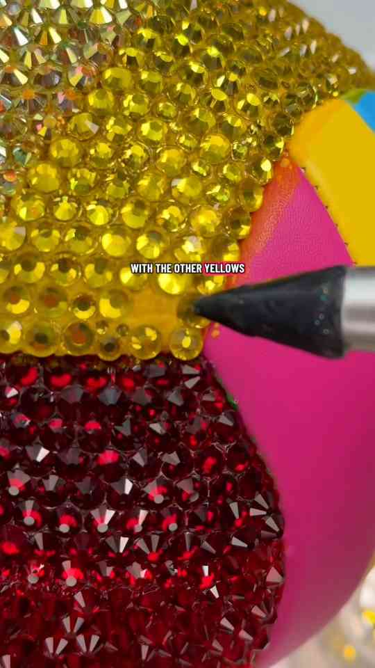 Bedazzling a rainbow volleyball - sparkling DIY
