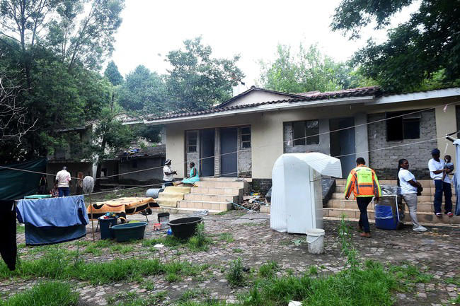 In pictures: Police arrest man suspected of hijacking a mansion in ...