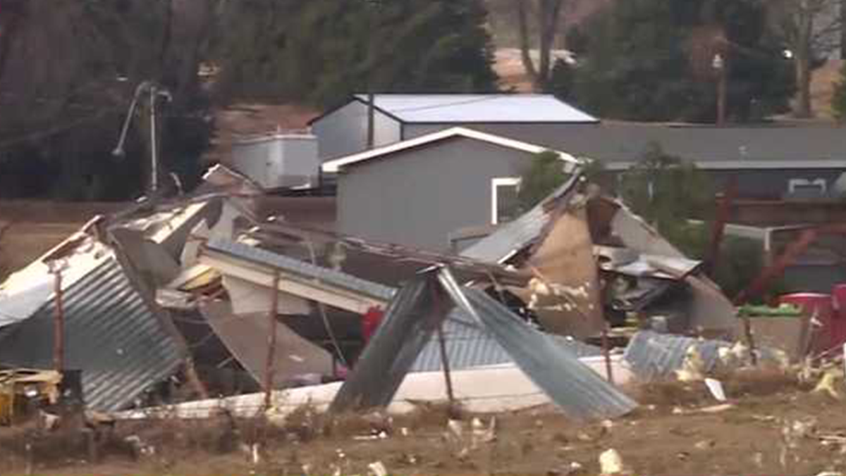 Structures damage and debris scattered throughout Purcell following tornado