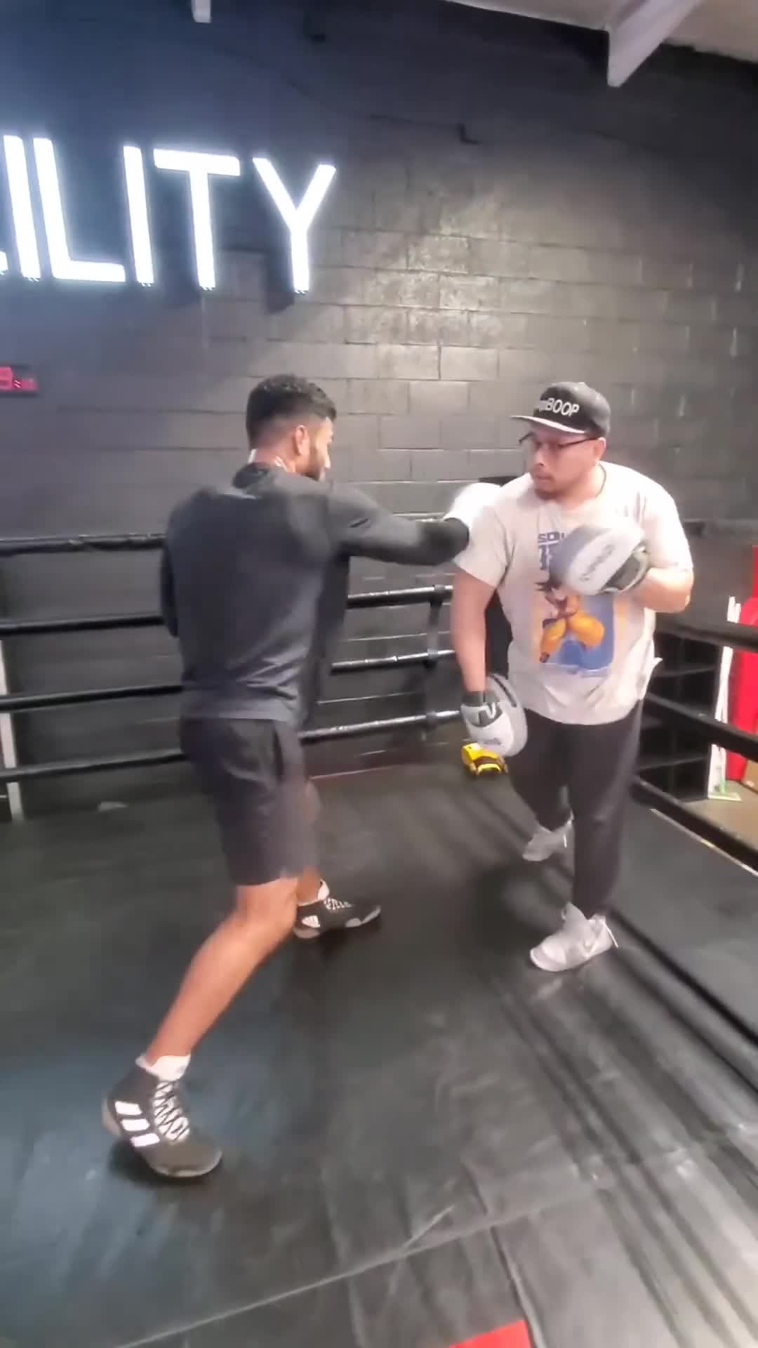 Coach Beep Boop in the lab building with Shane Mosley Jr