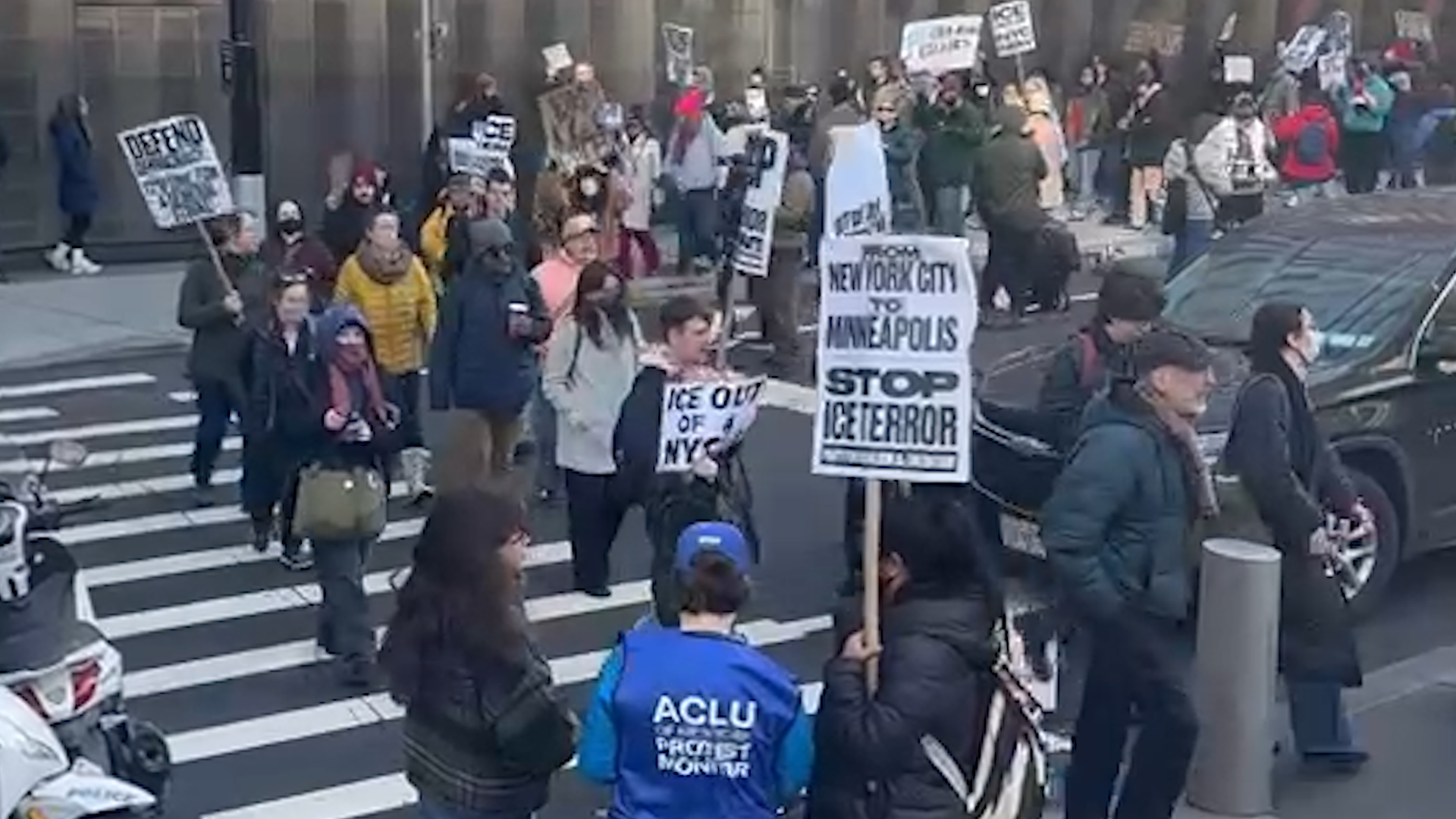 Protesters gather outside One World Trade ahead of Noem briefing