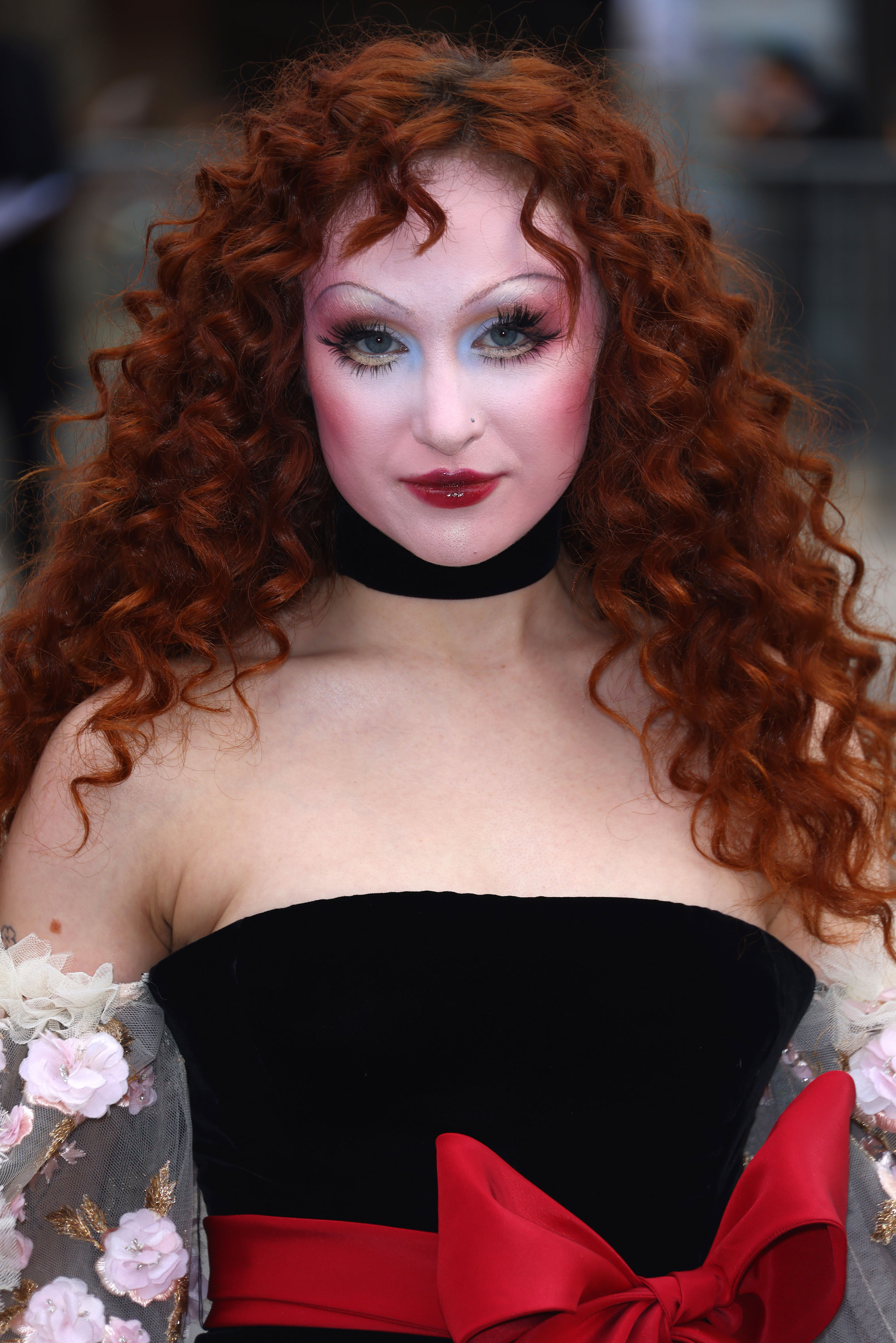 Everything you need to know about styling curly bangs