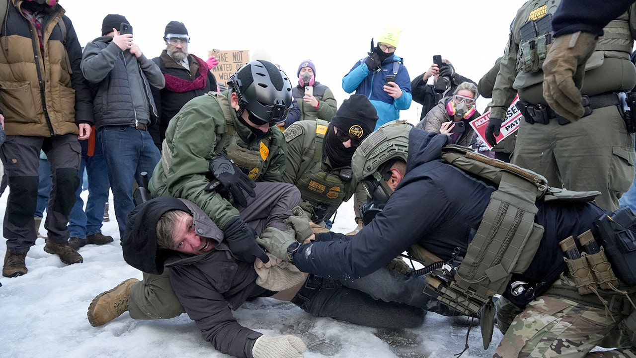 Minneapolis protesters confront federal agents day after deadly shooting