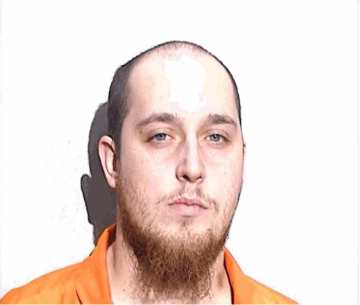 Two men arrested in shooting of man found in crashed van