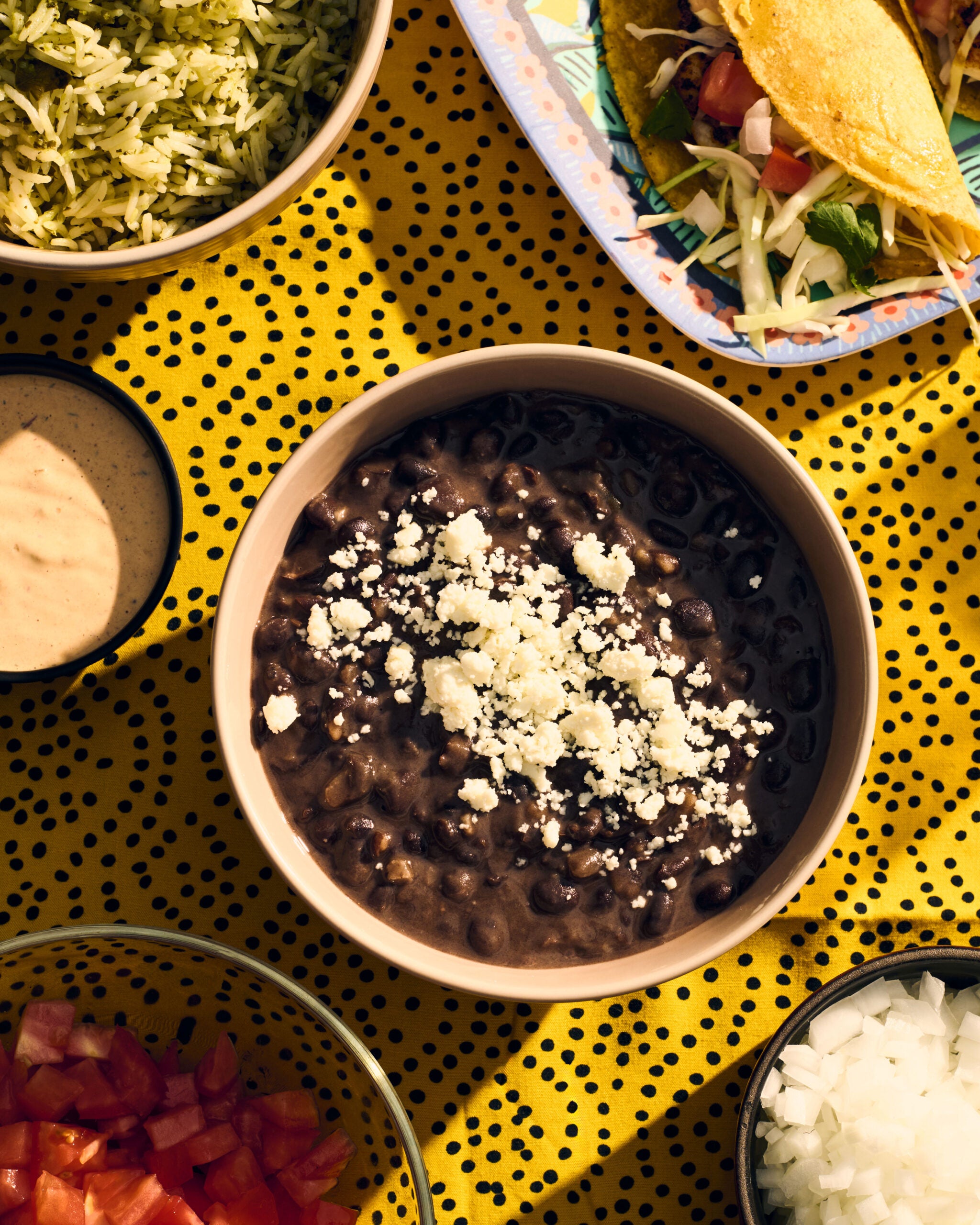 Spicy black beans with queso fresco