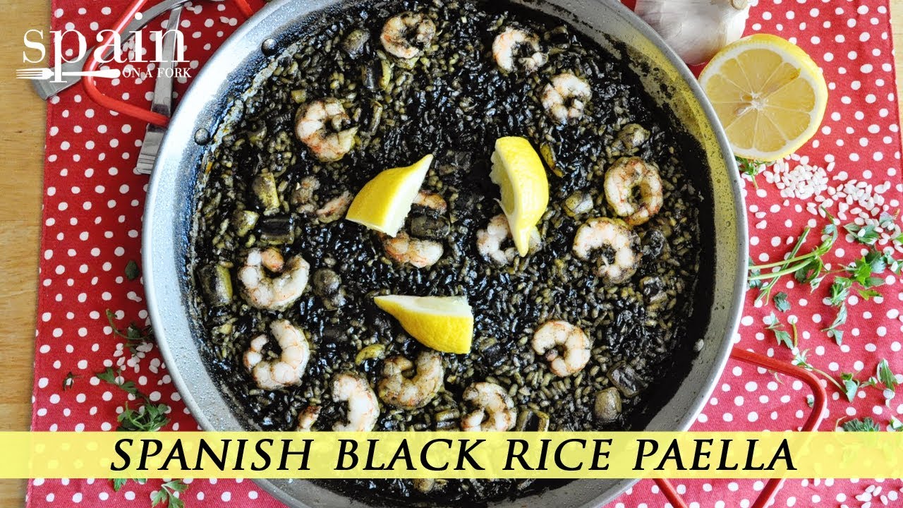 Spanish black rice paella with squid ink broth | Authentic seafood recipe