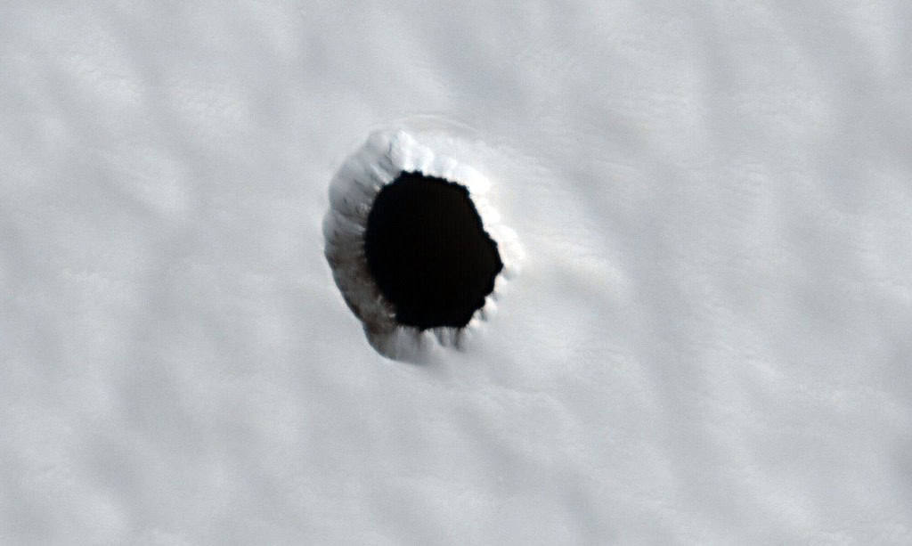 This mysterious hole on Mars could be key to keeping astronauts alive there