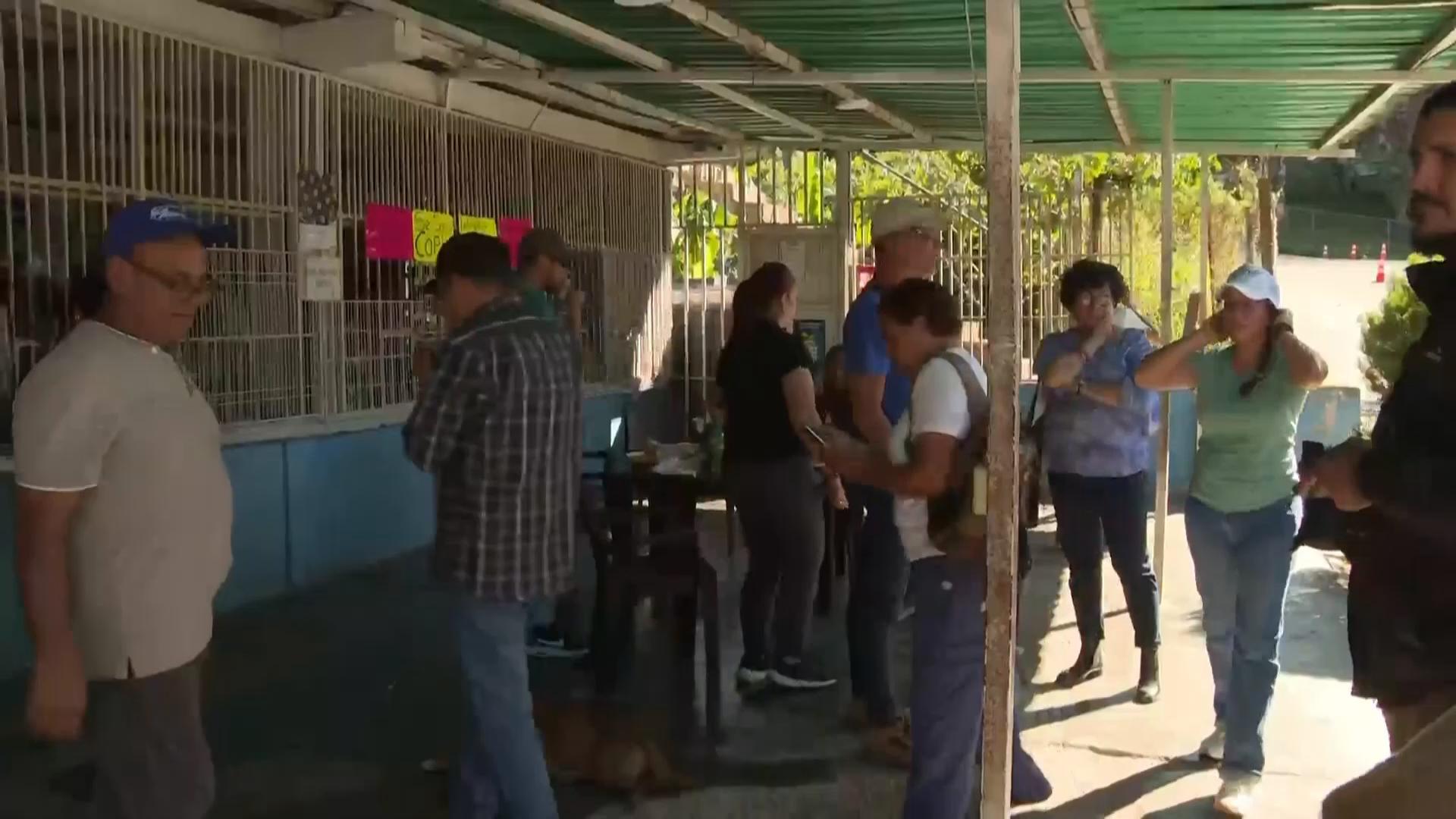 Relatives of Venezuelan prisoners wait anxiously after news of mass release