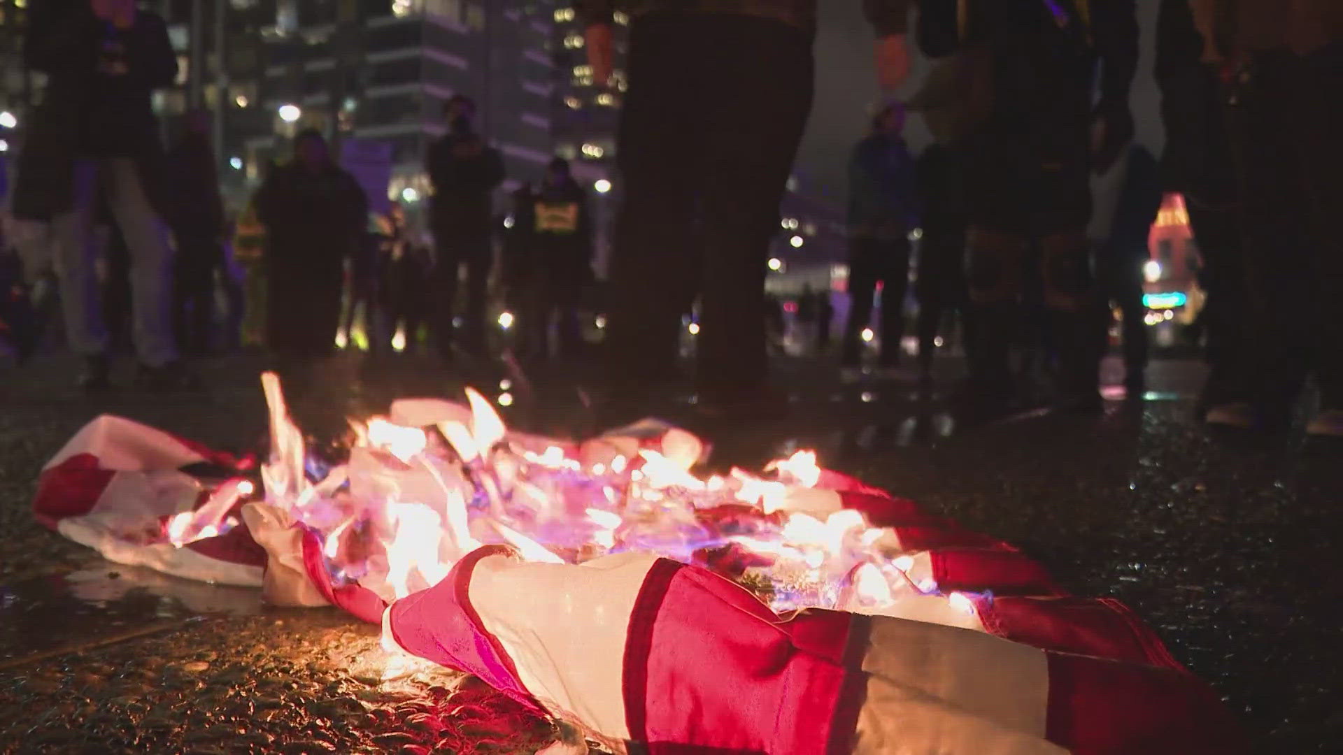 Seattle demonstrators hold vigil downtown for victims of federal shootings