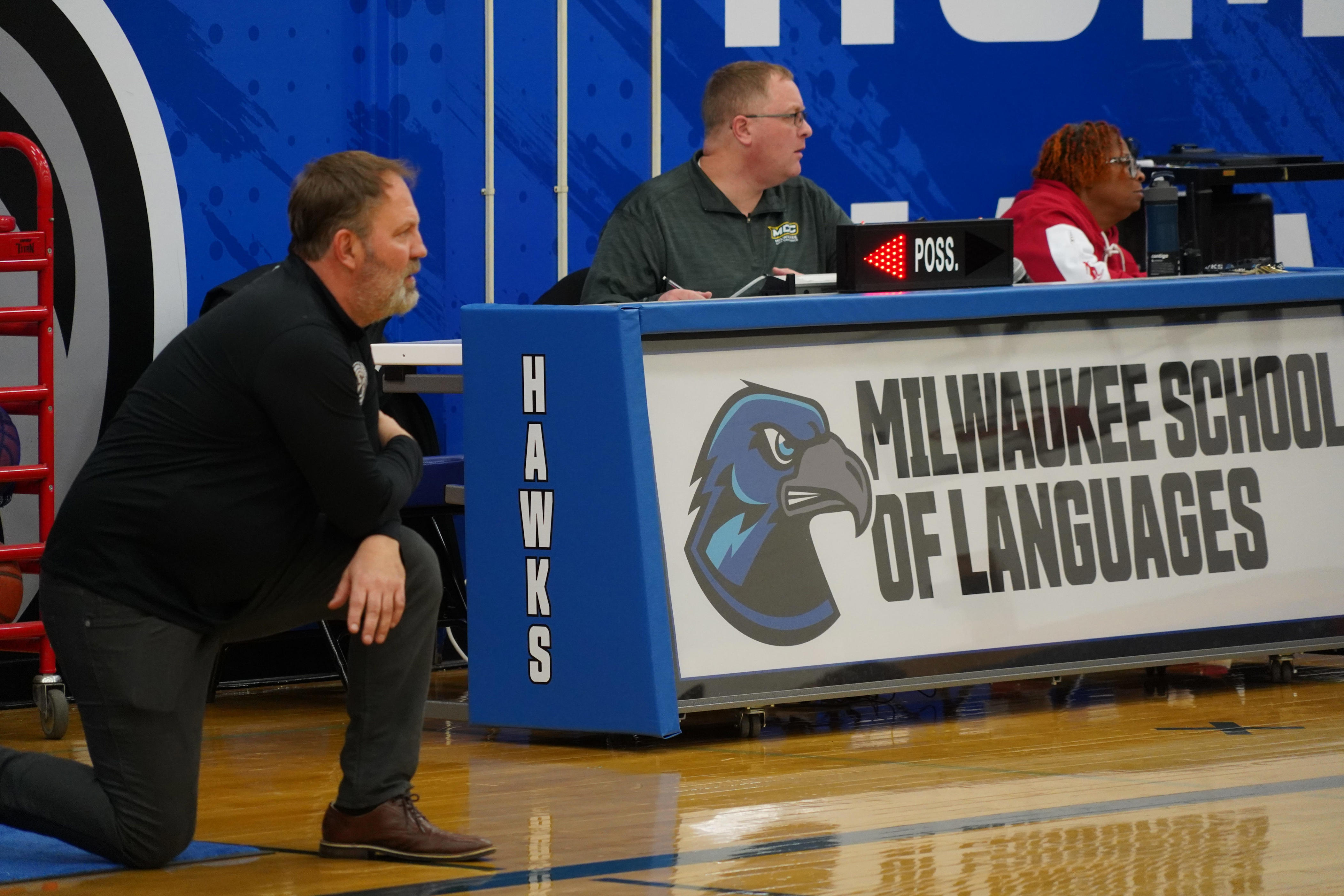 School of languages AD serving as interim boys basketball coach