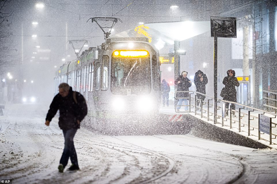 Chaos in Germany as -20C blizzards halt trains, planes and traffic