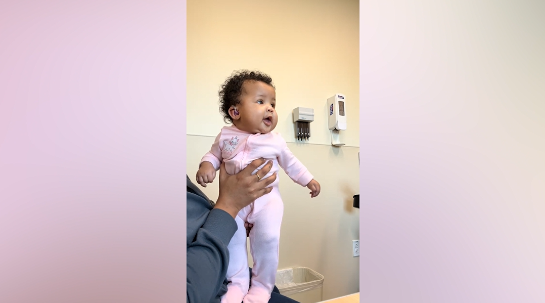 Moment baby gets hearing aids and hears for first time