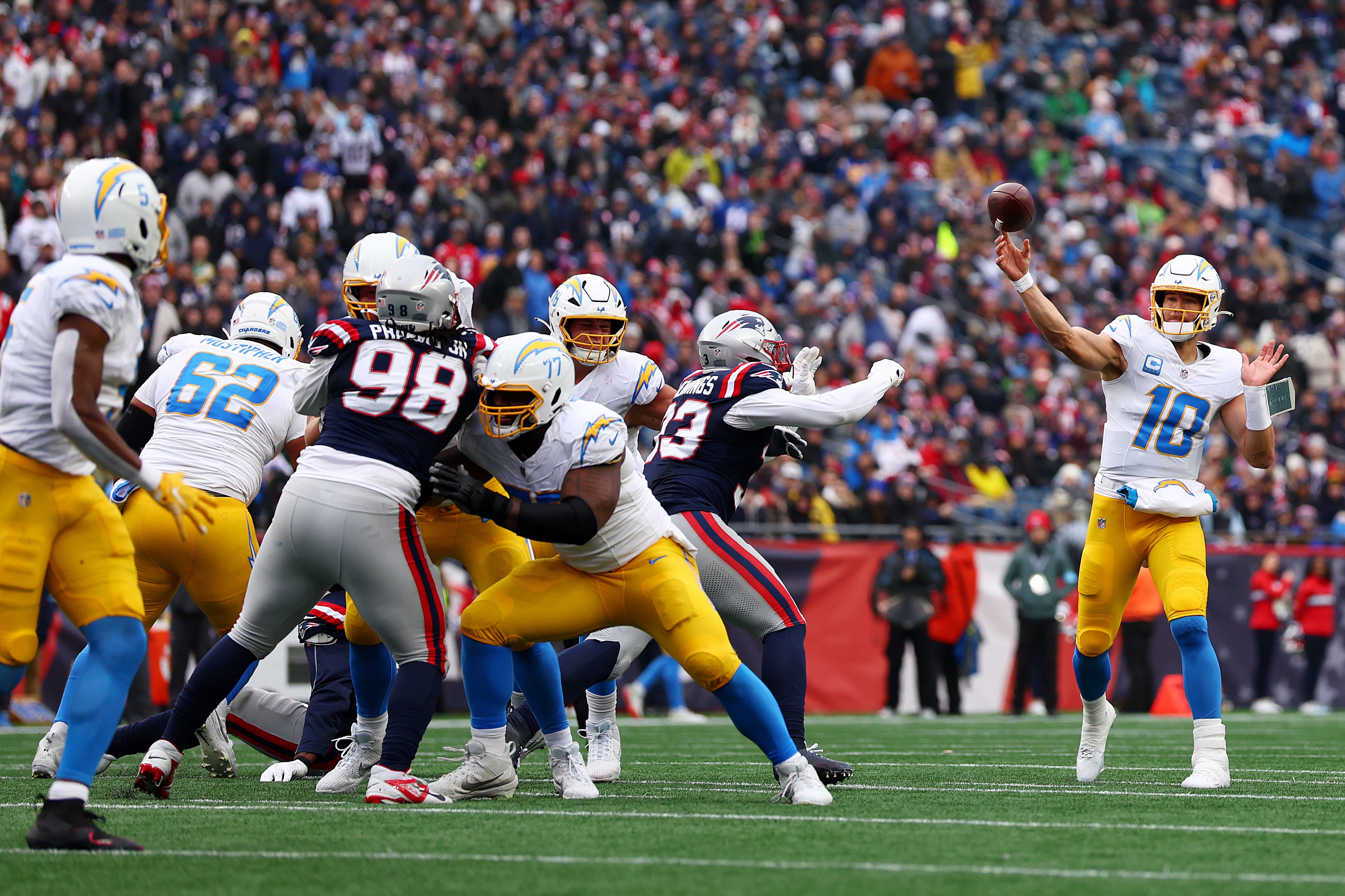 Who has the advantage in the Chargers vs. Patriots wild-card matchup?