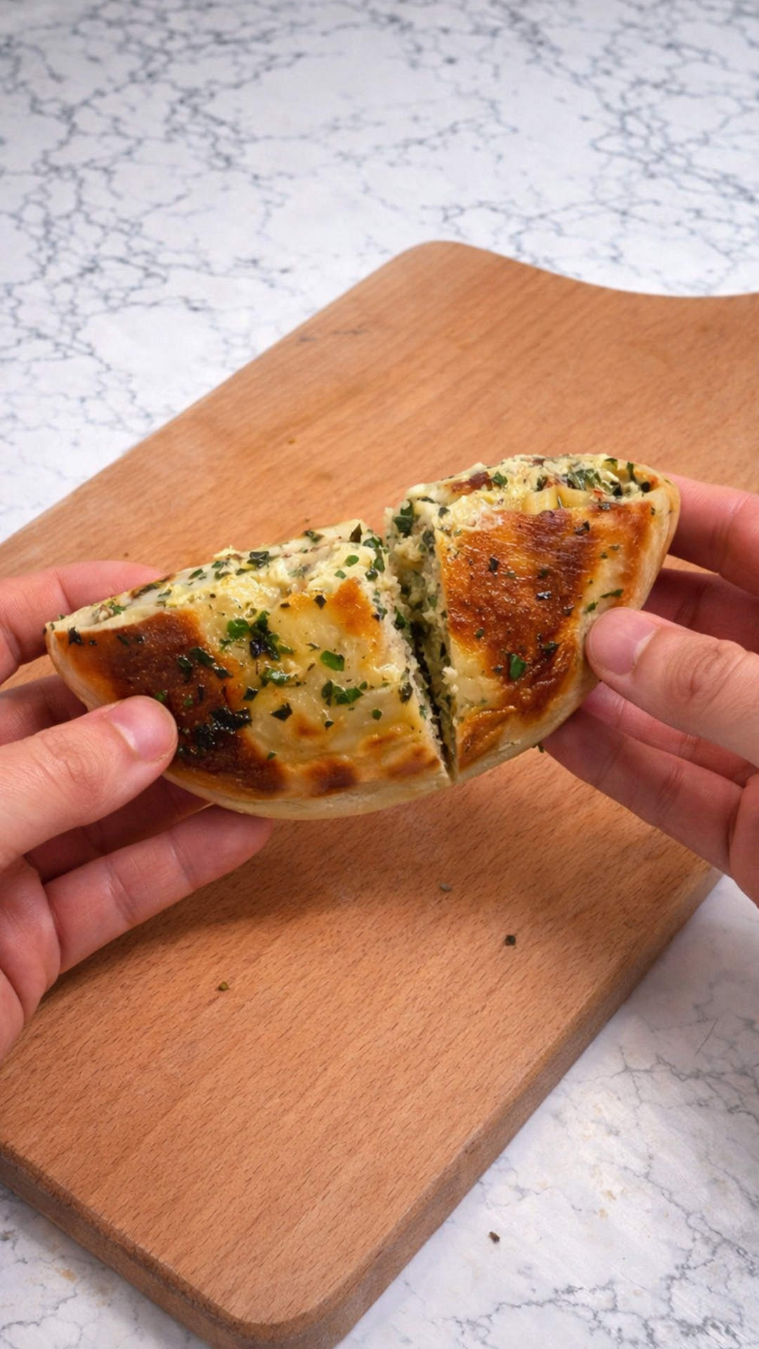 Cooking a vegan stuffed flatbread with creamy filling