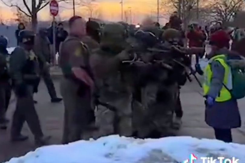 ICE agent pulls out gun in women's face amid ticking time bomb for ...