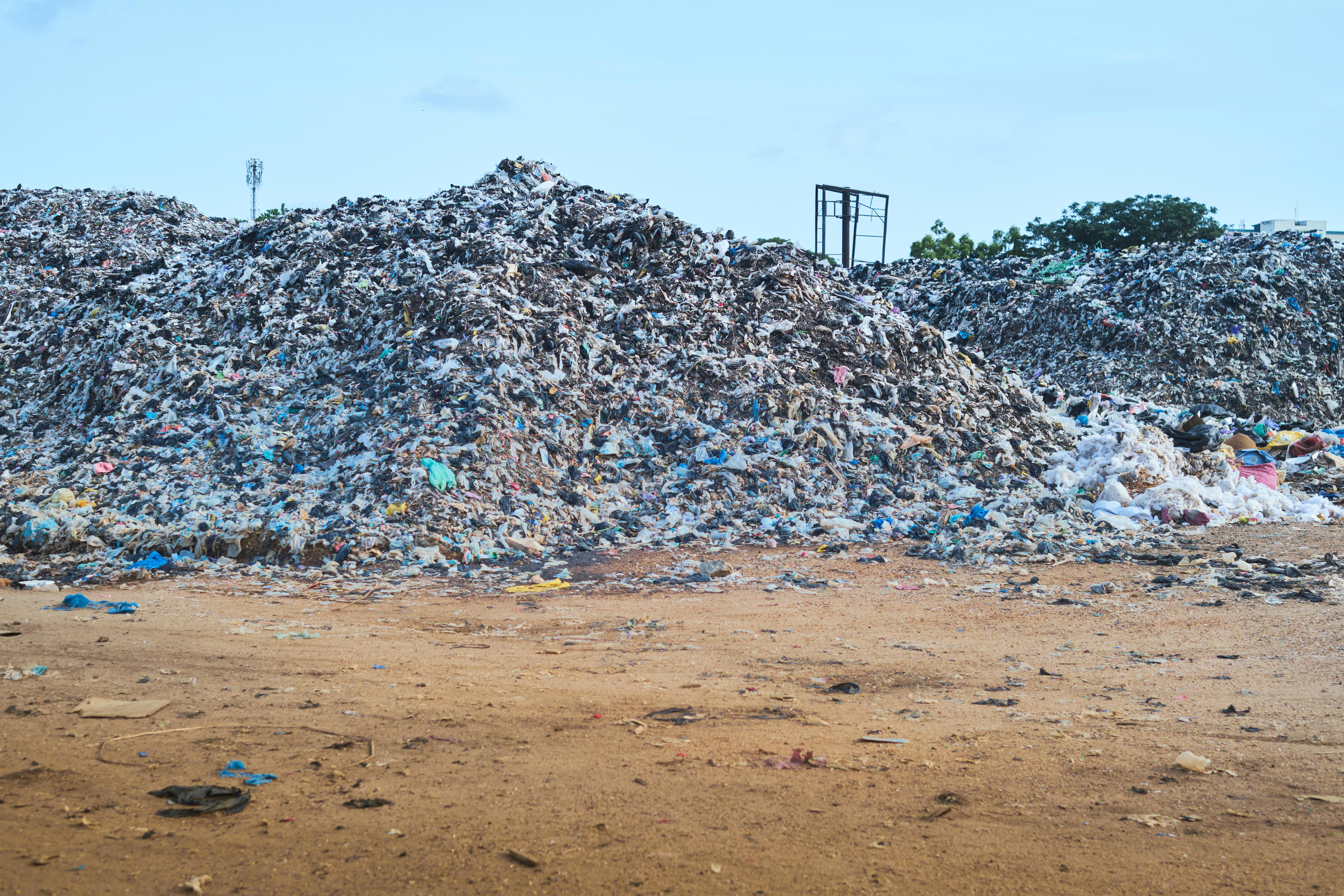 Dozens buried after massive mound of garbage collapsed