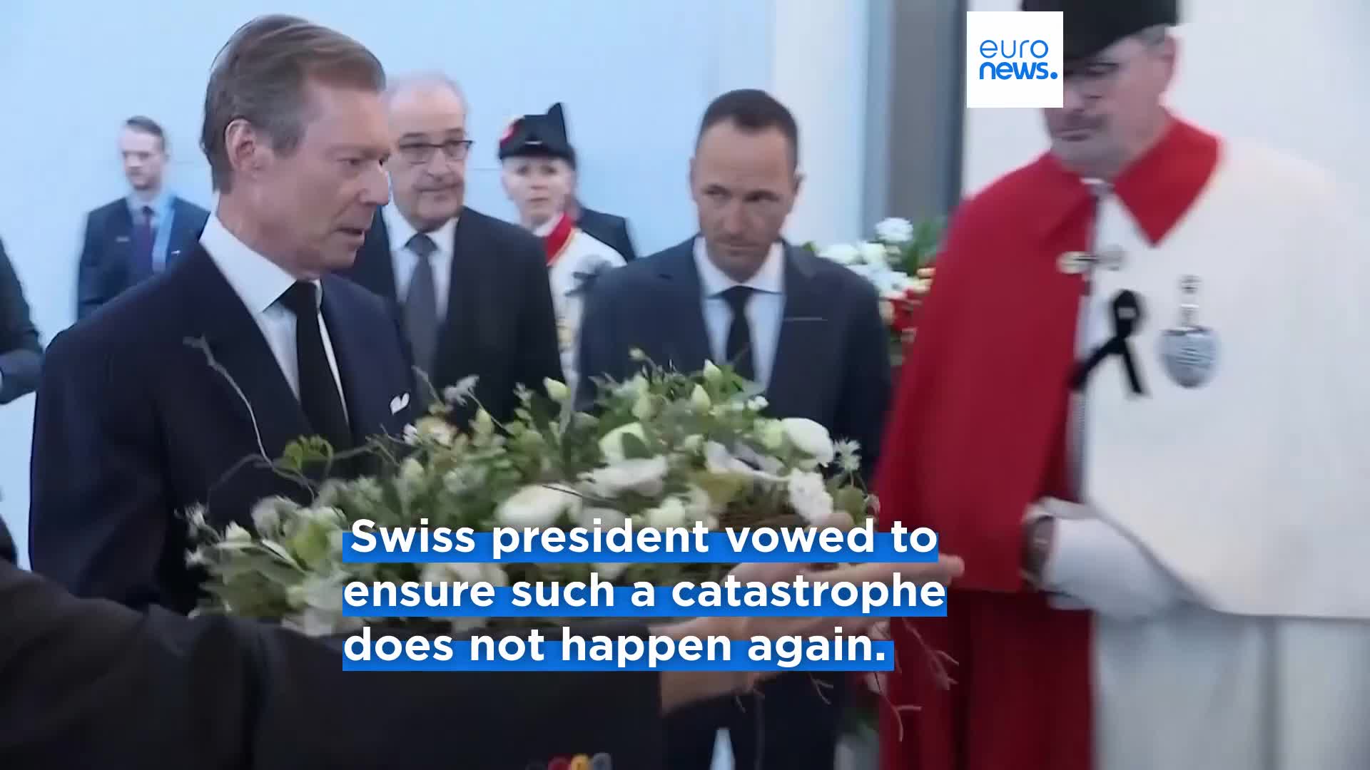 Manager of Swiss bar that caught fire killing 40 held in custody