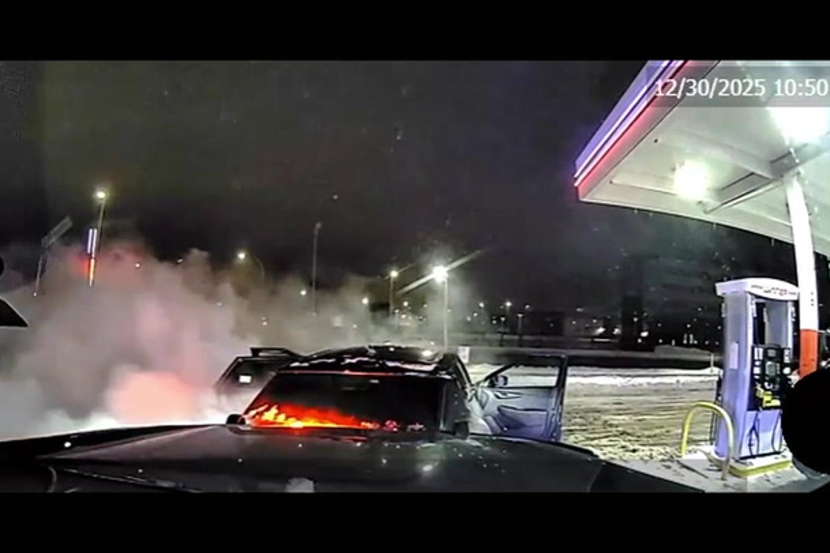 Cop uses squad car to push burning vehicle away from gas pumps
