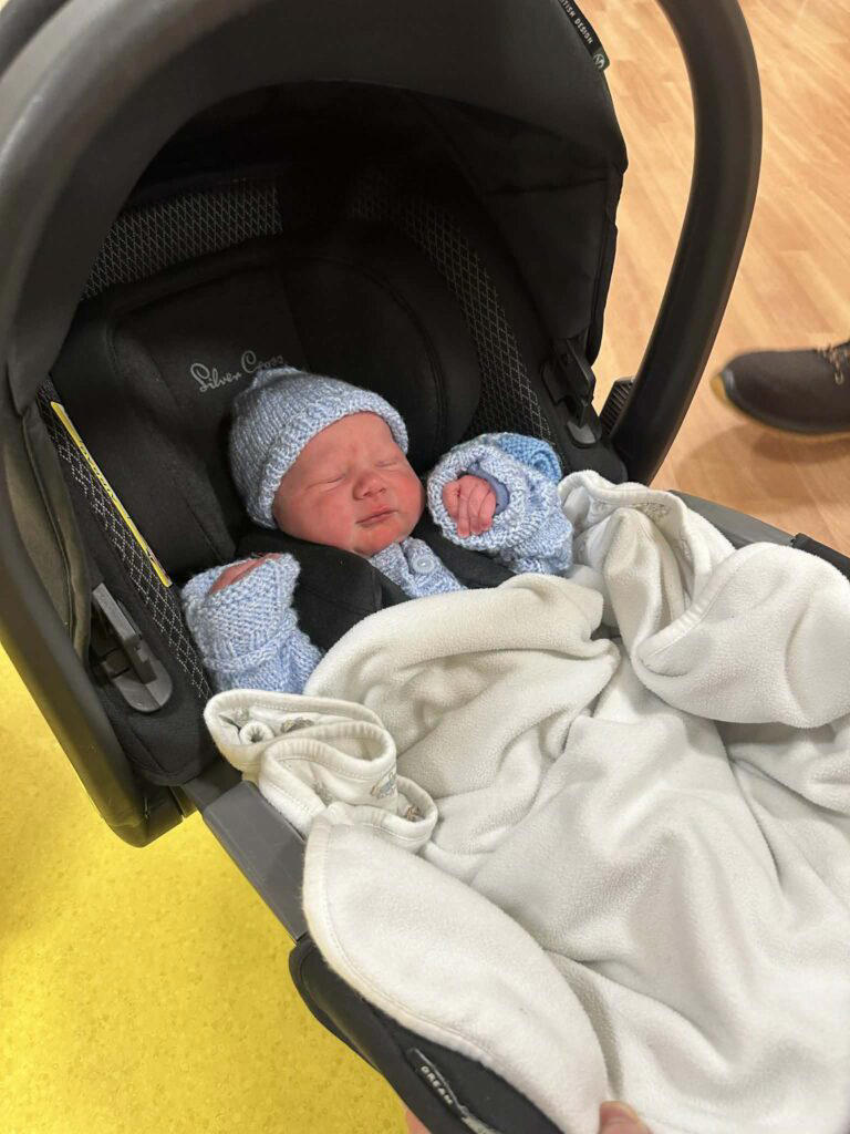 Newborn baby towed home by tractor after roads blocked by snow