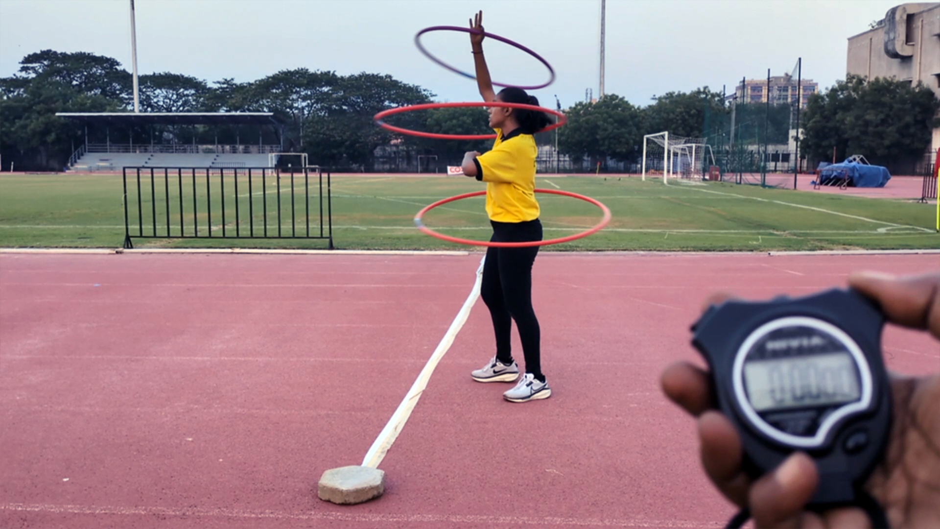 Fastest 100m while spinning three hula hoops (female) 32.01 seconds by ...