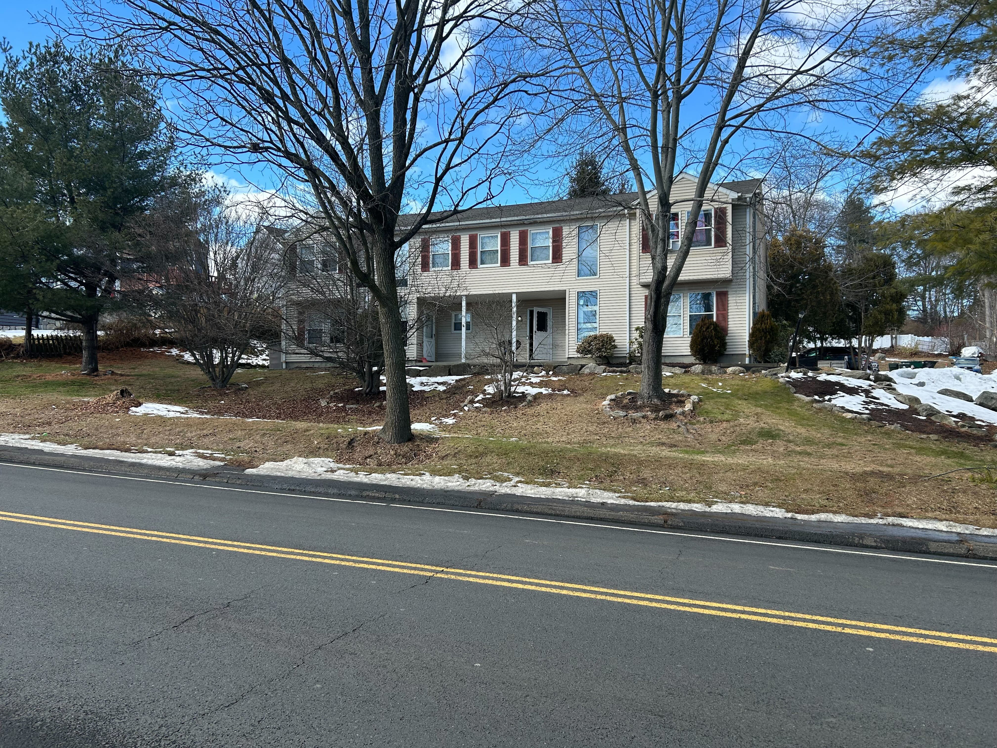 Bullet shot through wall kills person in home next door in Danbury