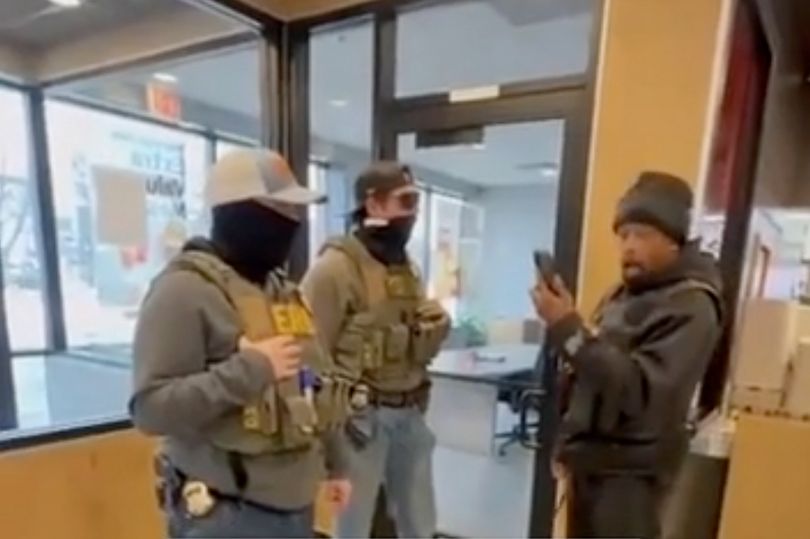 McDonald's security guard pushes back masked ICE agents trying to enter ...