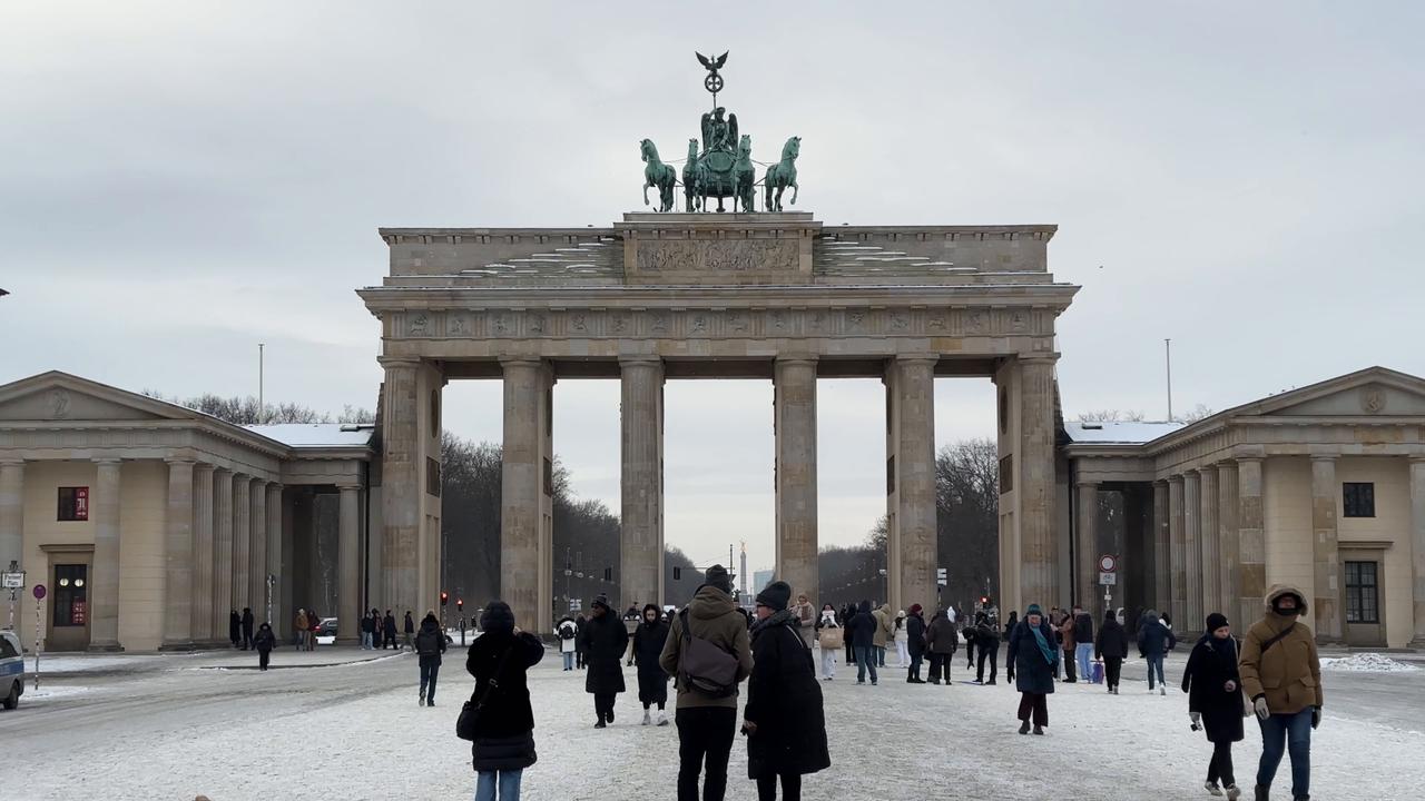 Germany: Winter weather grips Berlin as snow covers the Brandenburg ...
