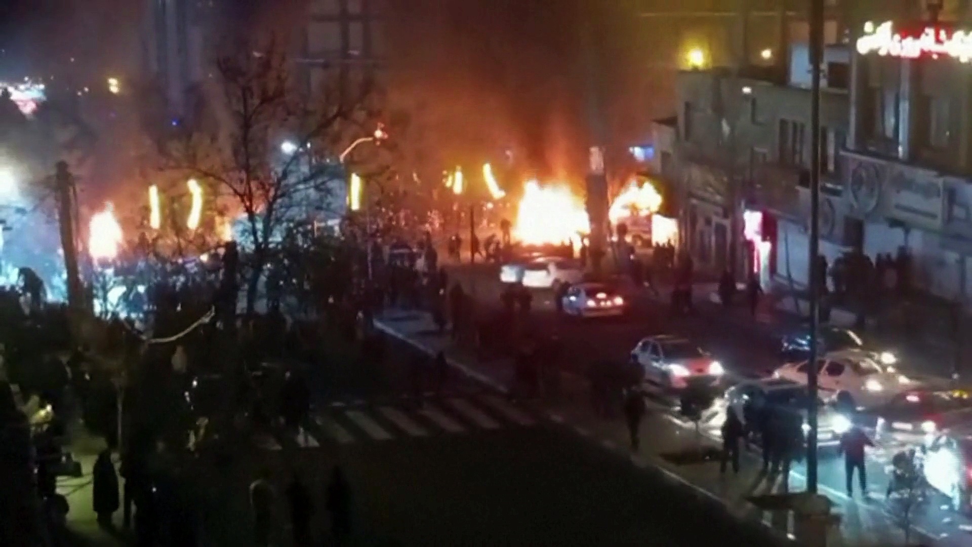 Building, cars set on fire in Iran amid protests