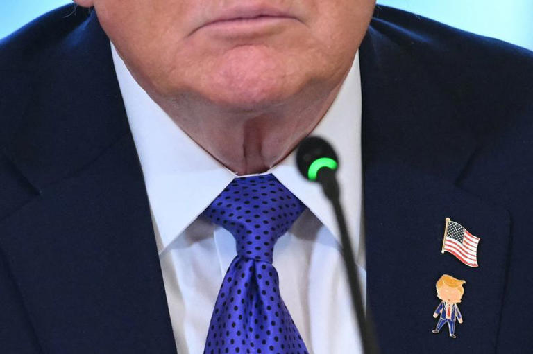 Trump's inflated ego on show as he wears pin badge of himself at ...