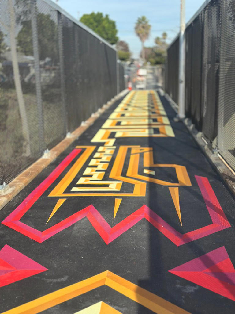 New mural between Barrio Logan, Logan Heights reclaims bridge as canvas ...