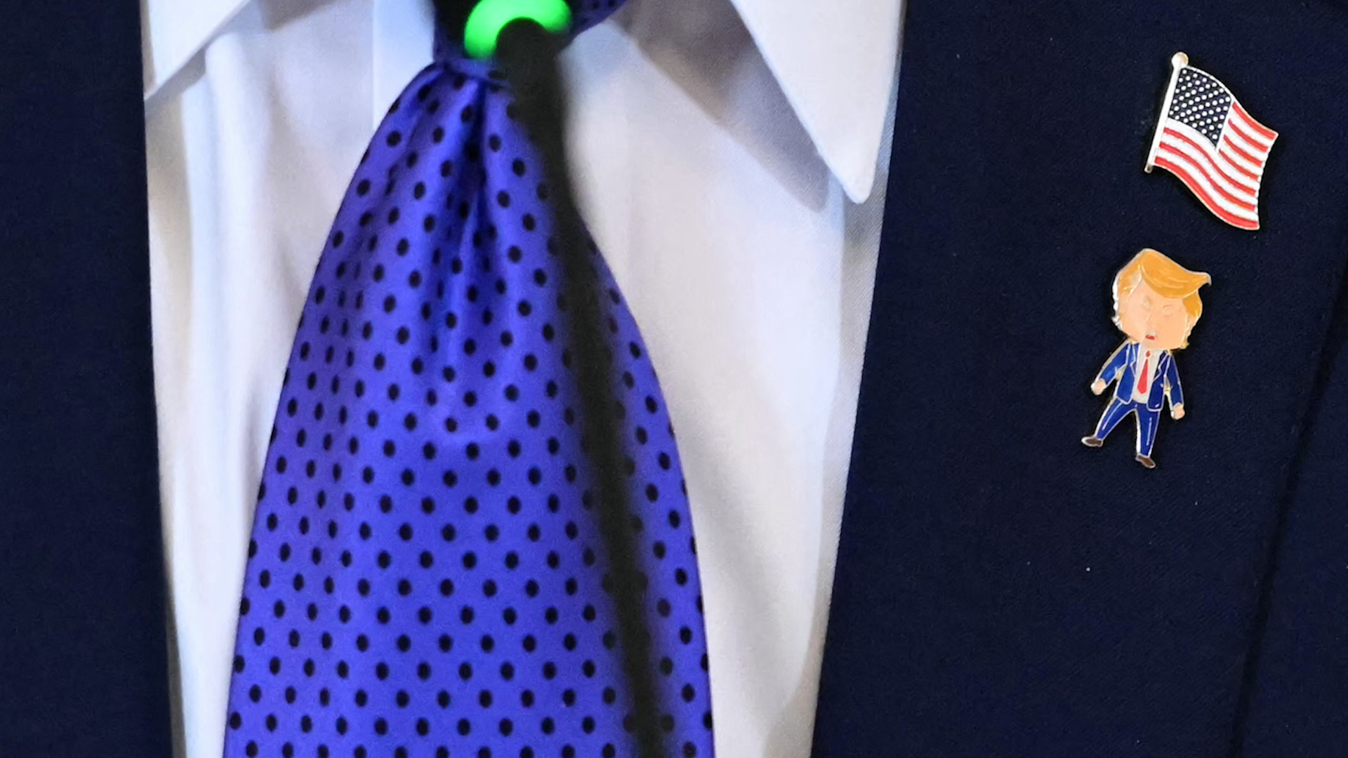 Trump shows off 'Happy Trump' pin