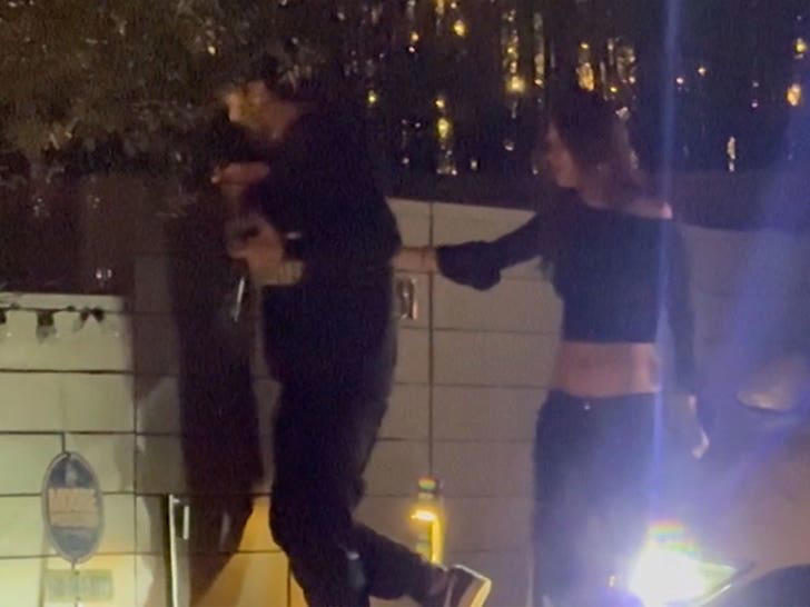 Tobey Maguire scales wall with beer in hand while out with mystery girl ...