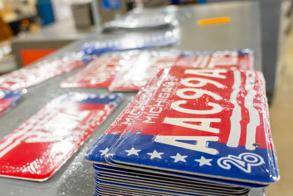 State prisoners begin work on anniversary license plates