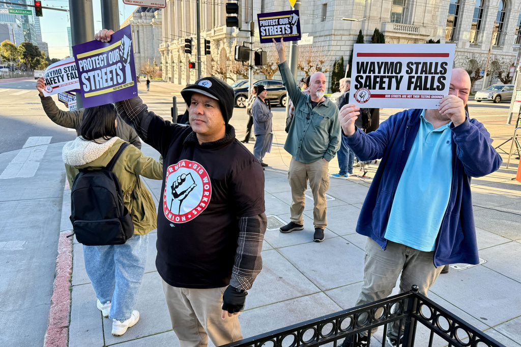 Lyft and Uber drivers protest Waymo robotaxis as California considers ...