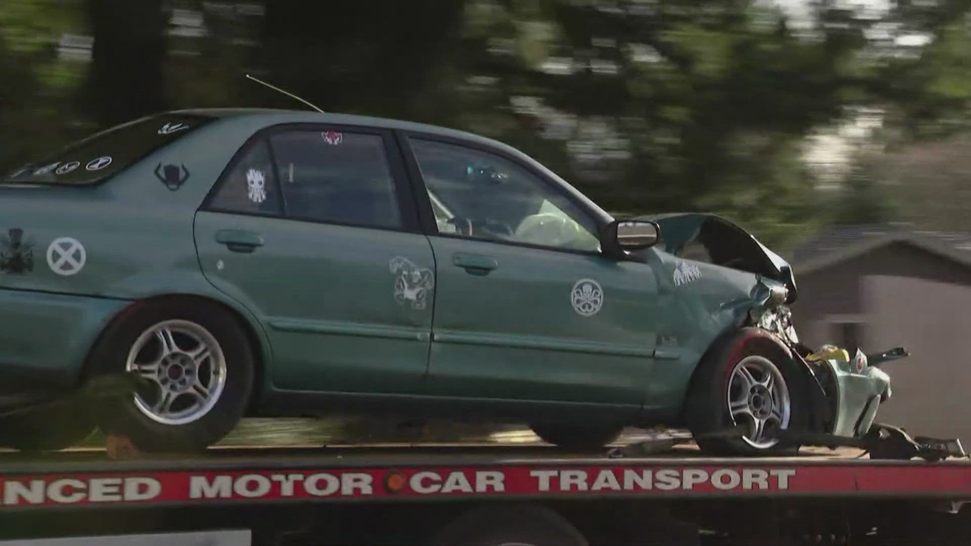 Breaking: Car hits bus, 11 students hospitalized