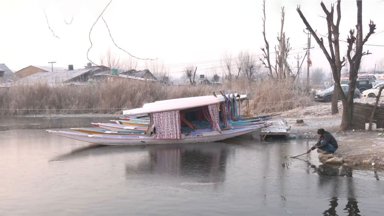 Winter's grip: Thin ice on Dal Lake, dense fog blankets North India